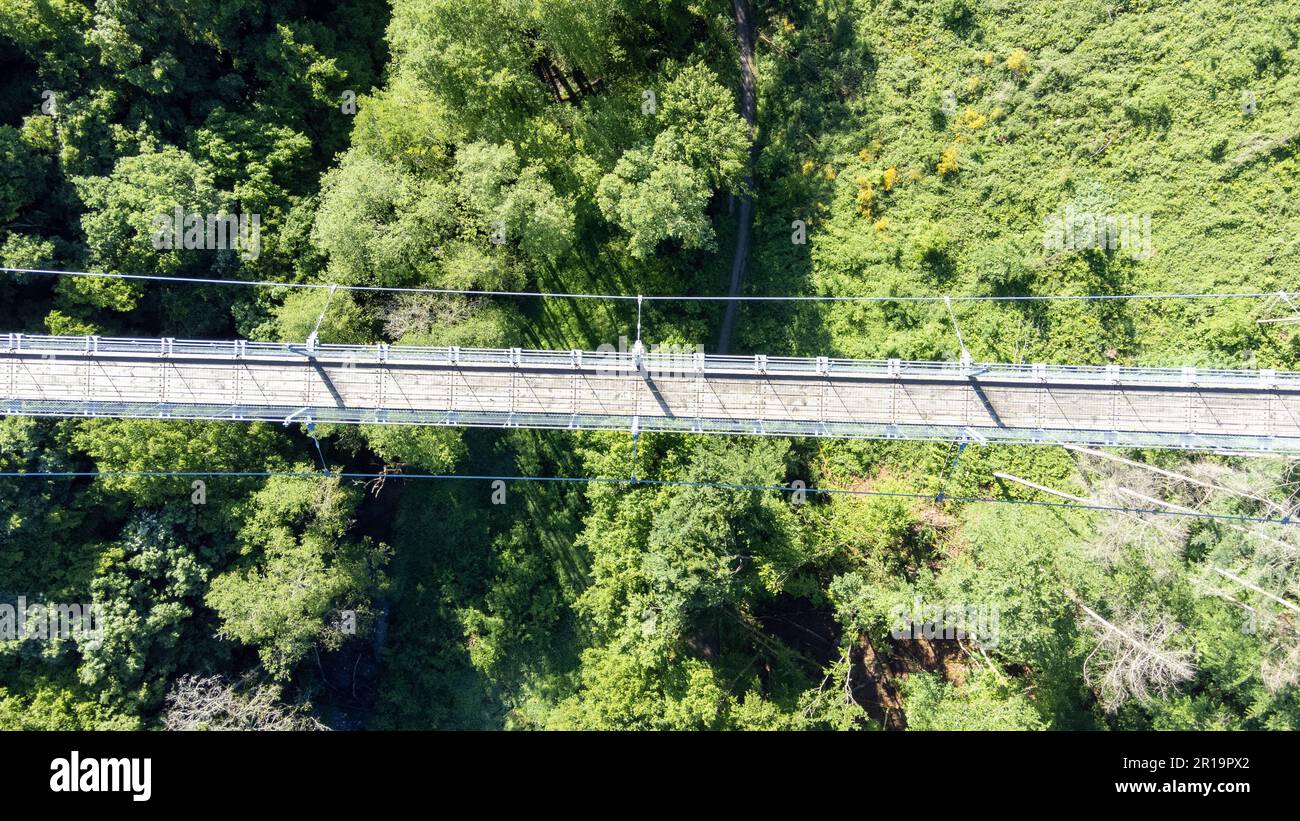An aerial view of Geierlay Suspension Bridge against the background of ...