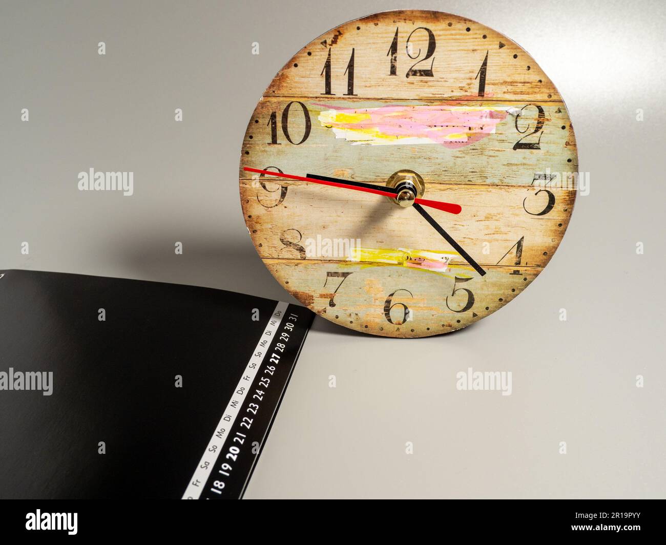 Close-up of retro clock and calendar with push pins. Time concept Stock ...