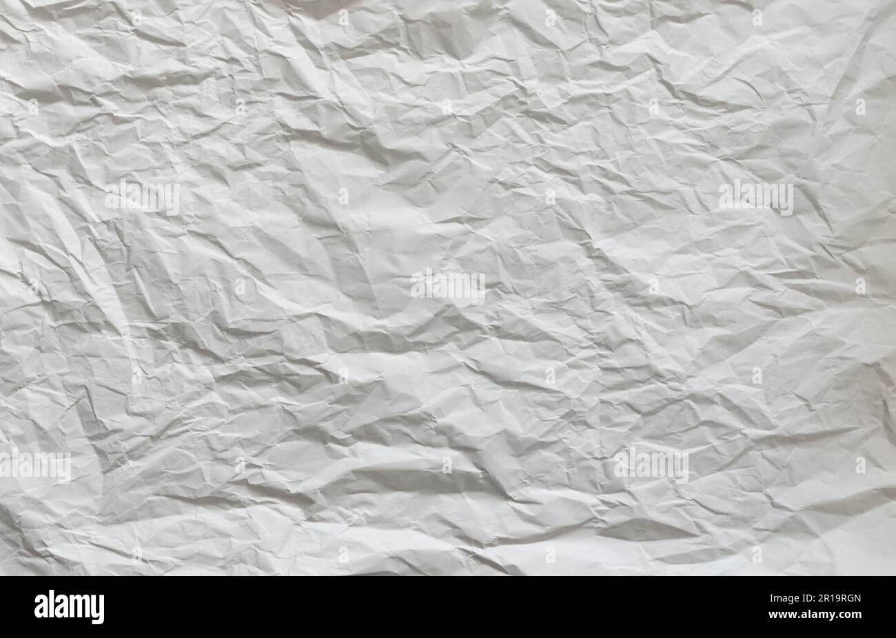 Wrinkled white paper background. Empty crumpled material with a random ...