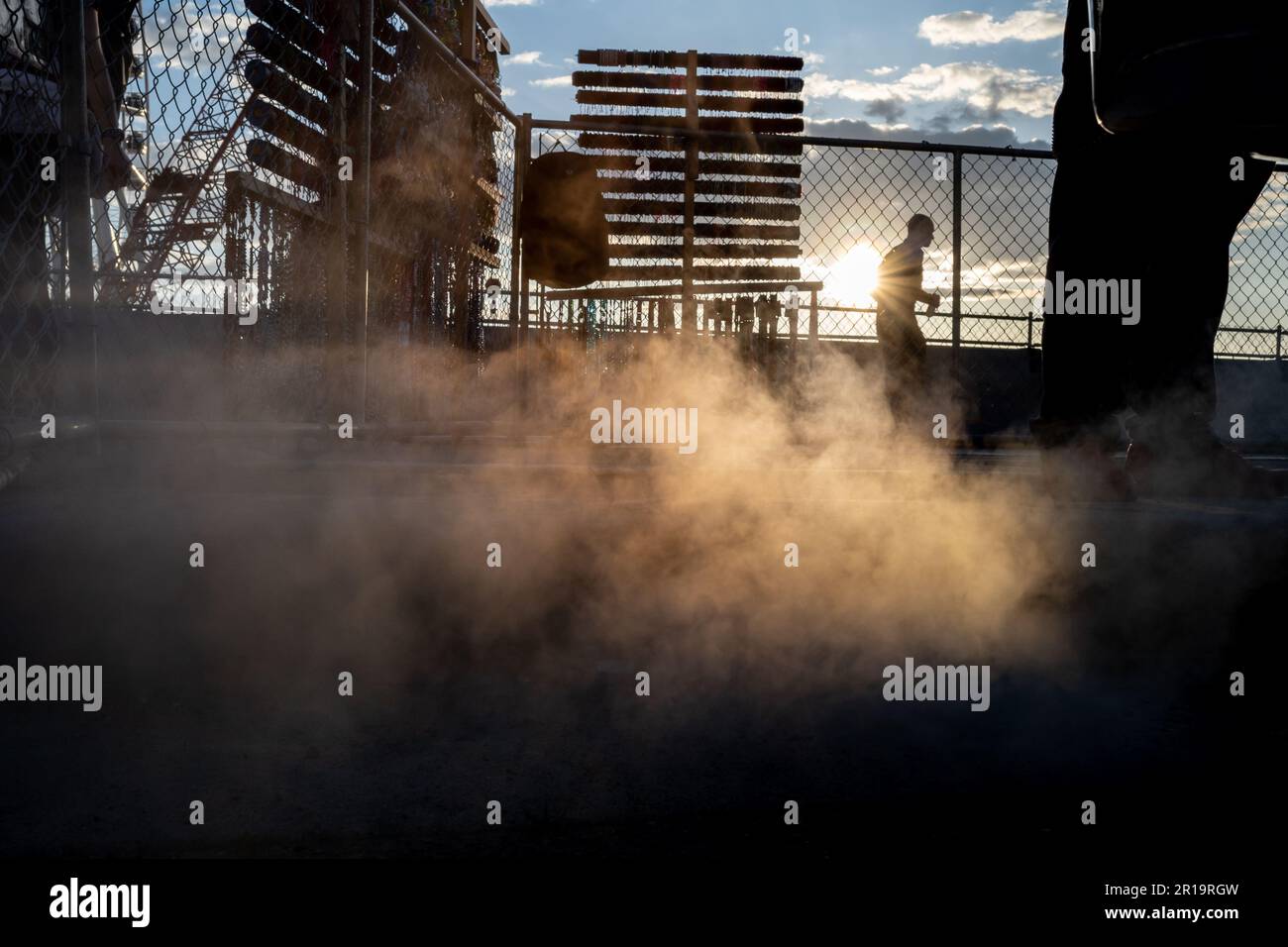 Seattle, USA. 22 Mar, 2023. Smoke coming out of a car exhaust at sunset ...
