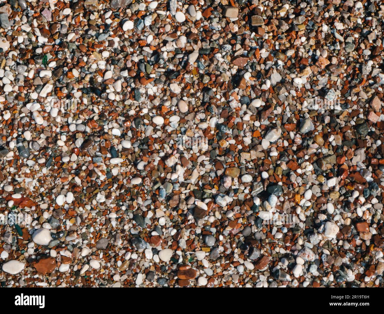 Wet sea pebbles or rocks, stones as nature background. Beautiful sea ...