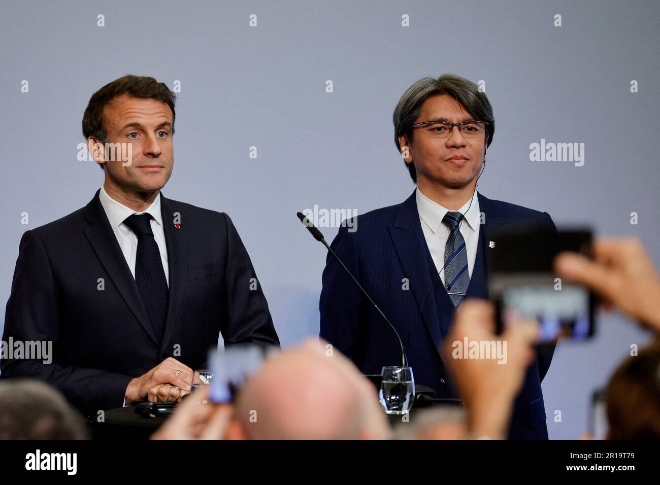 French President Emmanuel Macron, left, and ProLogium CEO Vincent Yang ...