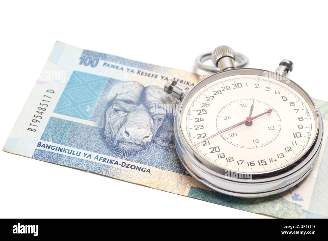 Time is money concept, stopwatch on South African money 100 rand ...