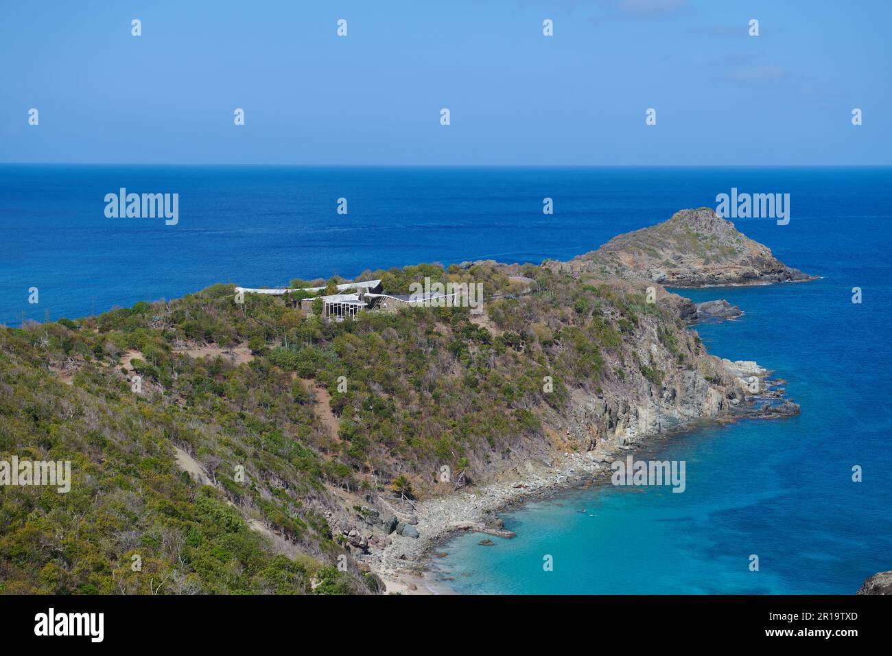 A view of the Rockefeller house above Colombier beach on the island of ...