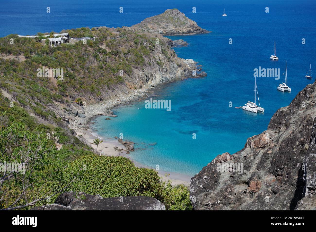 A view of the Rockefeller house above Colombier beach on the island of ...