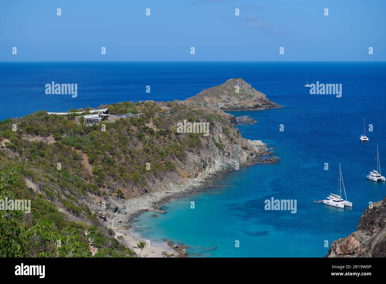 A view of the Rockefeller house above Colombier beach on the island of ...
