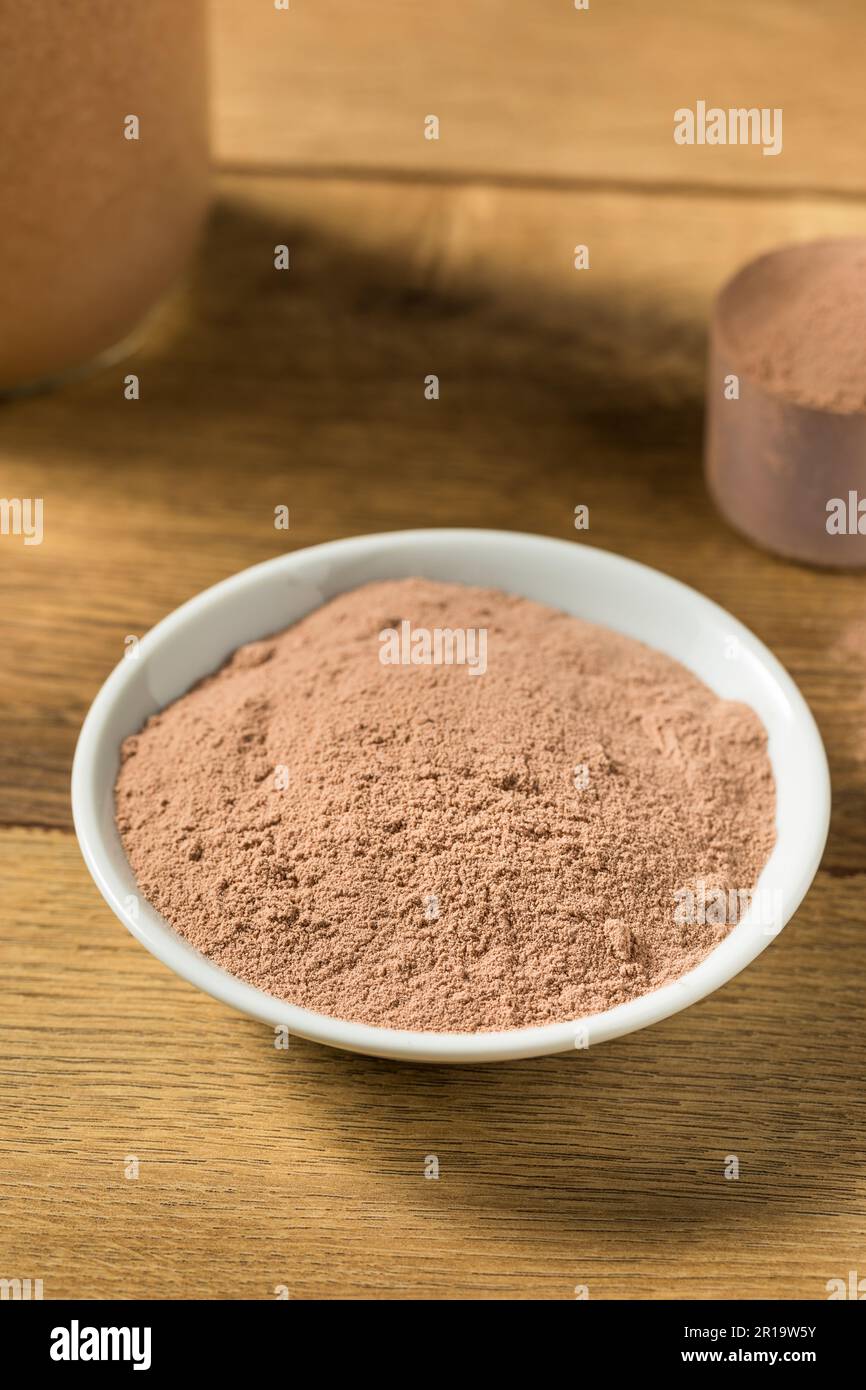 Organic Chocolate Whey Protein Powder in a Scoop Stock Photo - Alamy