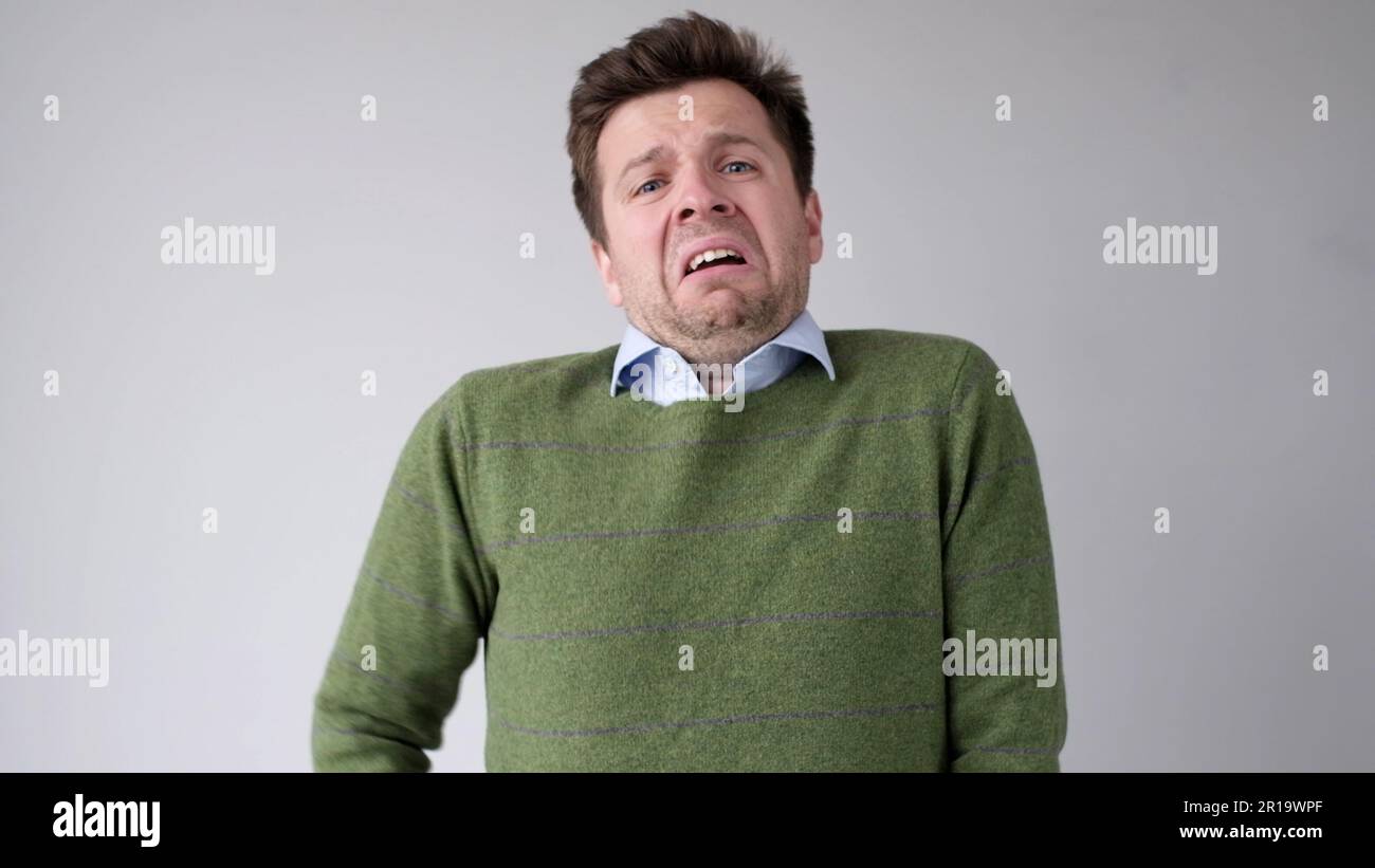 The young European man is crying from a life failure. His girlfriend ...