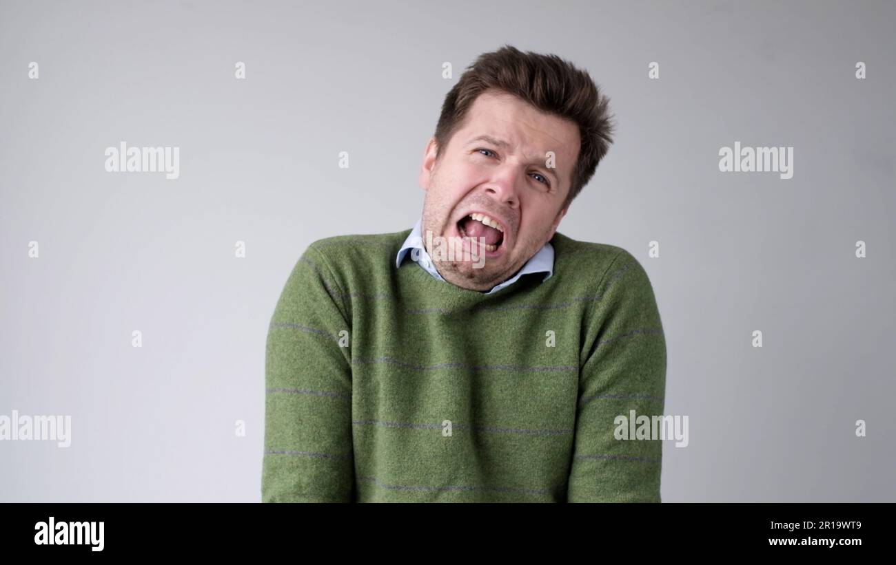 The young European man is crying from a life failure. His girlfriend ... The young European man is crying from a life failure. His girlfriend ...