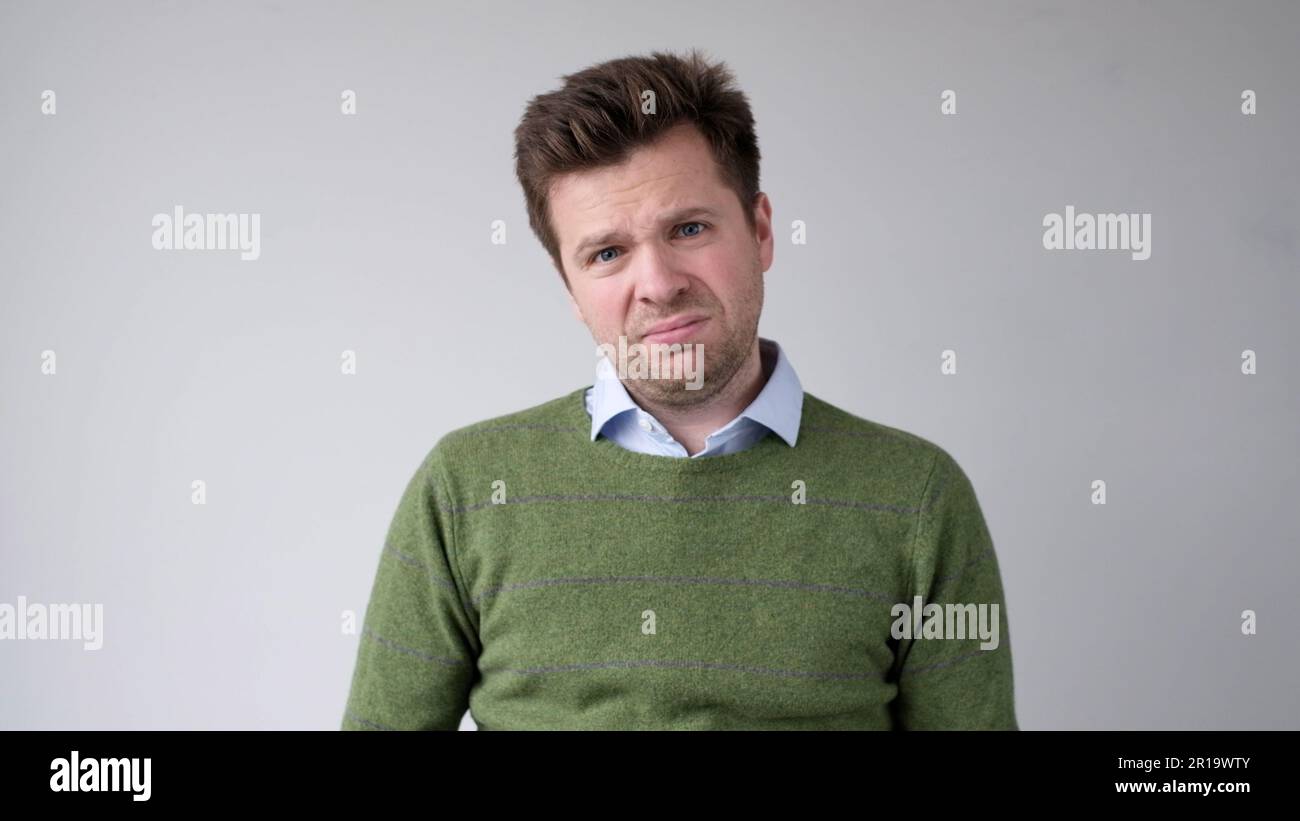 The young European man is crying from a life failure. His girlfriend ...