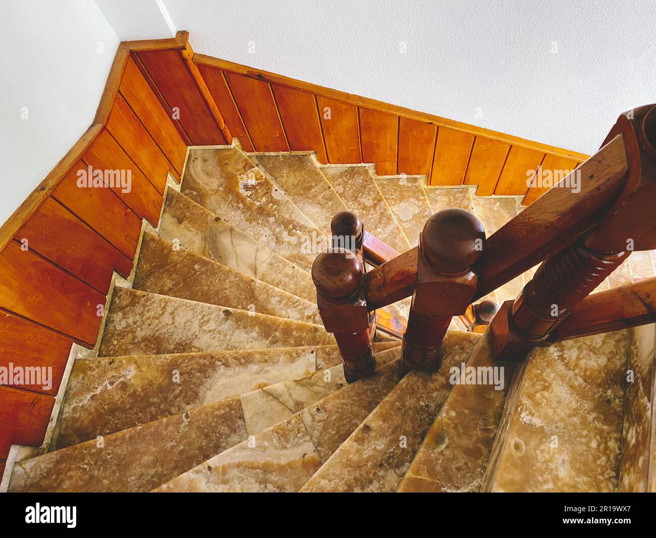 marble staircase in the hotel. many steep steps, a sharp turn on the ...