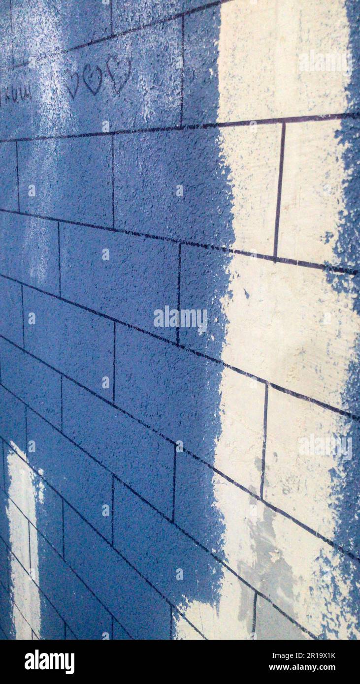 production of decorative plaster, bricks on the balcony wall. the ...