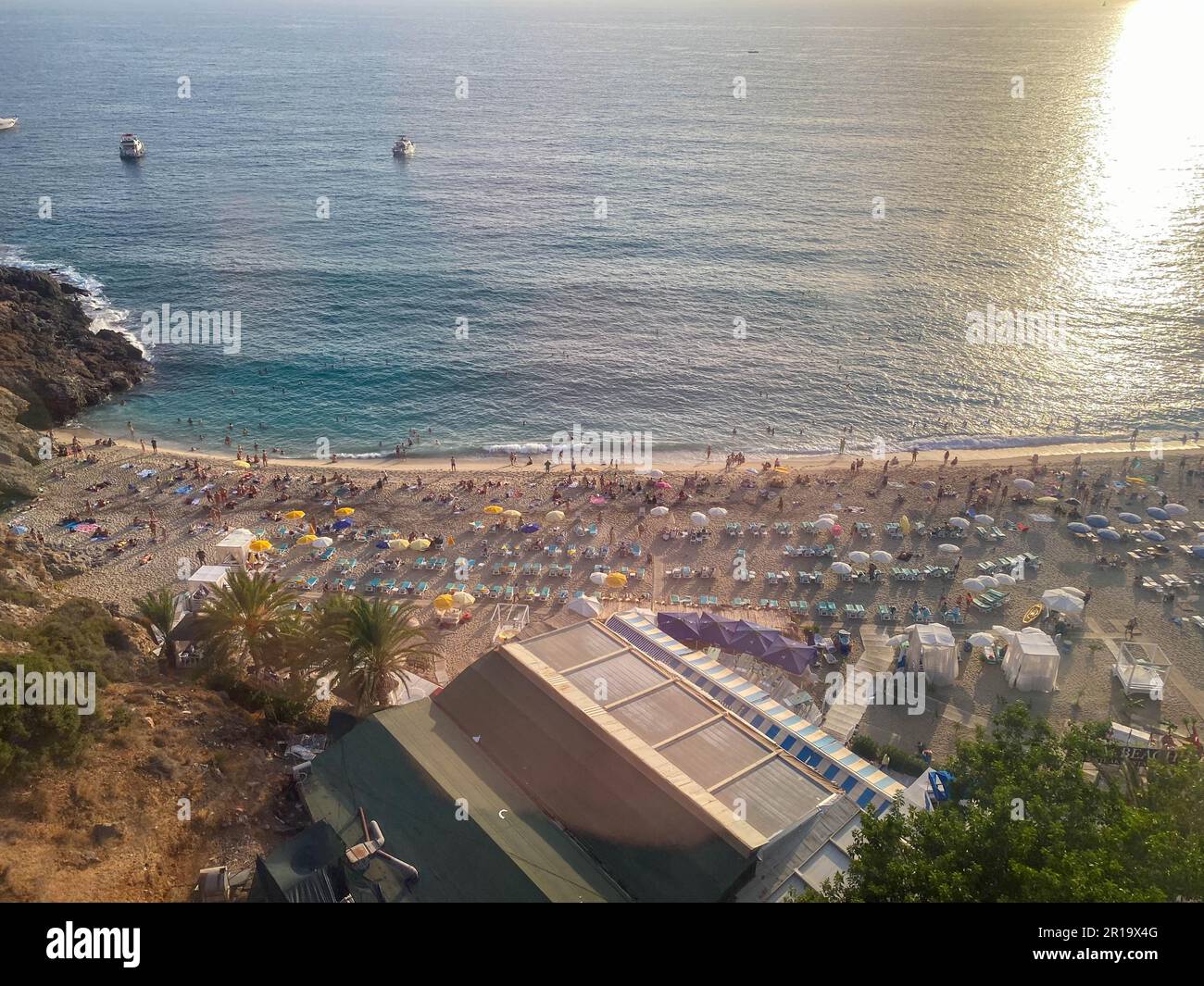 View of the beaches with sun loungers and sun umbrellas on the sea ...