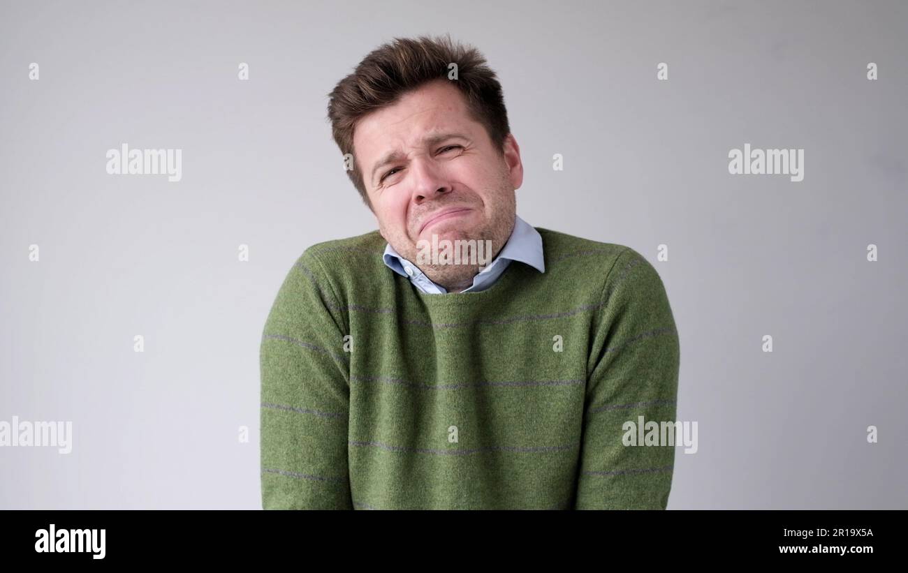 The young European man is crying from a life failure. His girlfriend ...