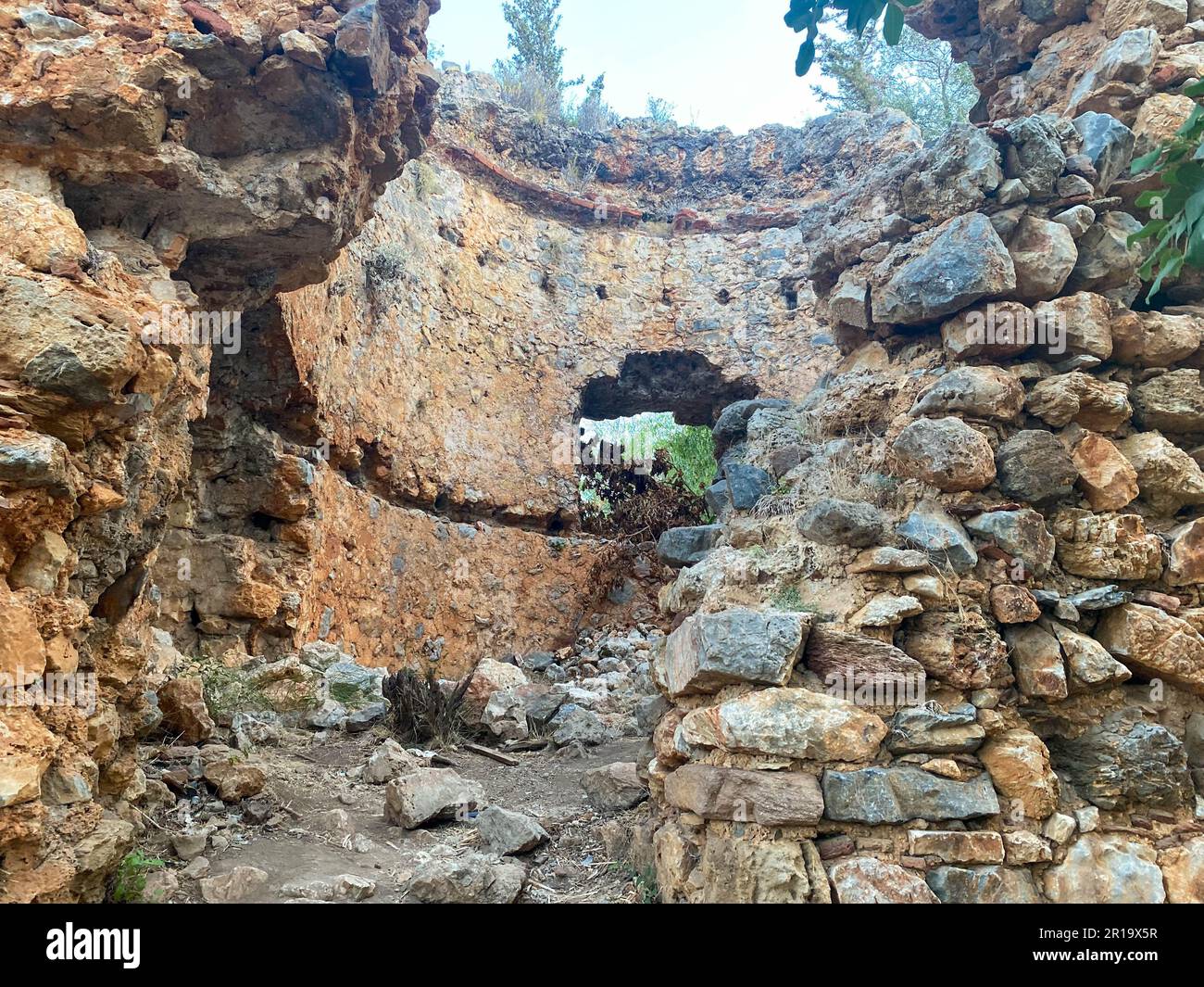 The ruins of an ancient old broken ruined medieval fortress made of ...
