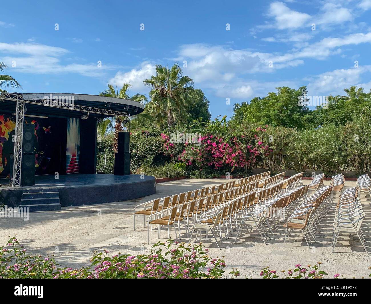 Stage for performances and mass events with many chairs outdoors in the ...