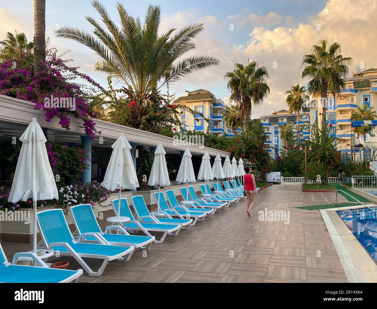 Sun loungers for relaxing and sunbathing with sun umbrellas near the ...