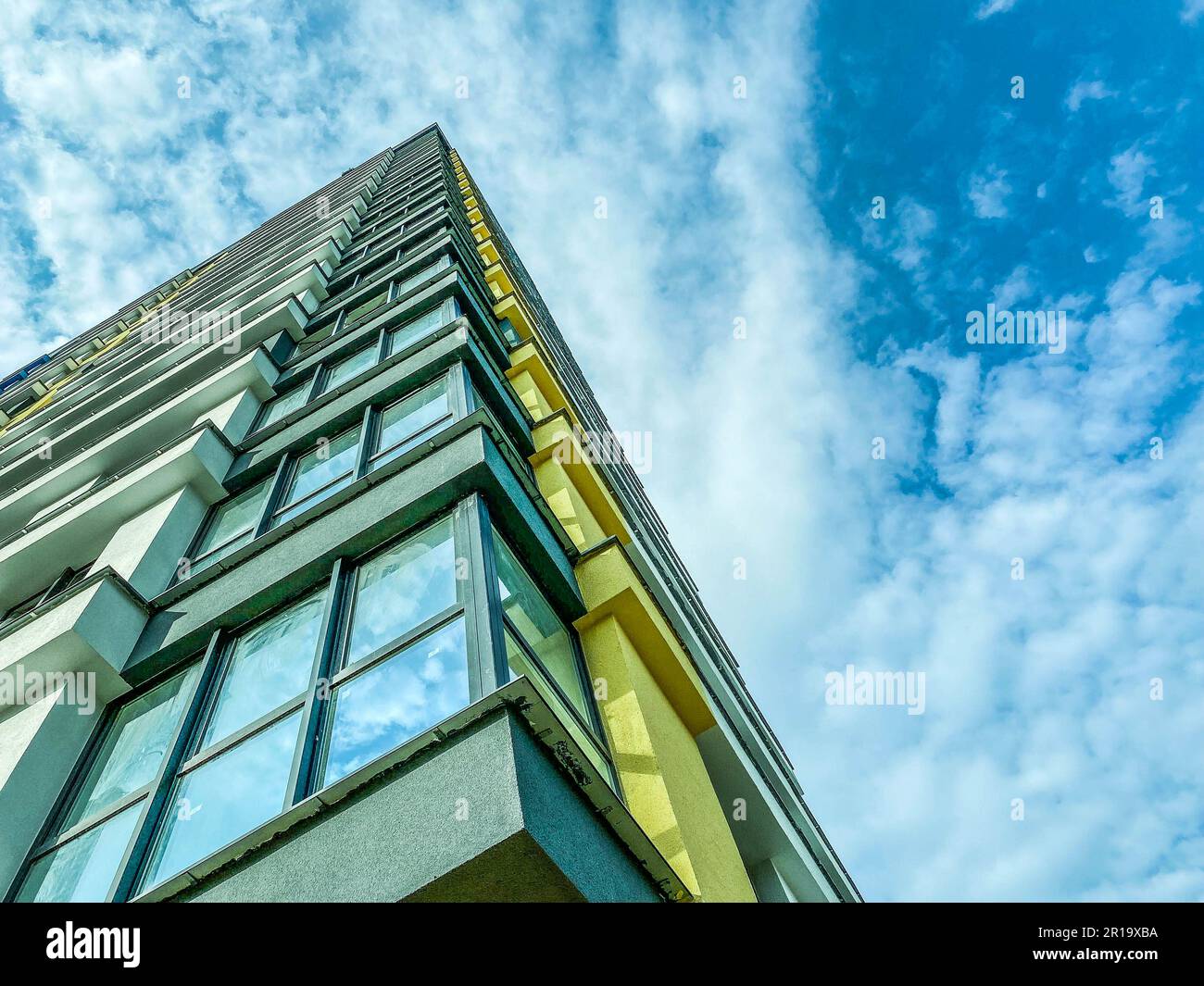 high-rise block building. corner of the house with glass and panoramic ...