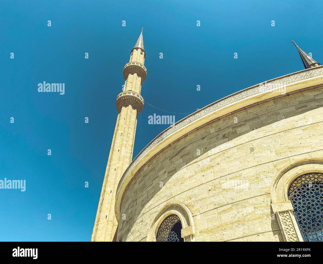 mosque against the background of a blue and bright sky. beauty of ...