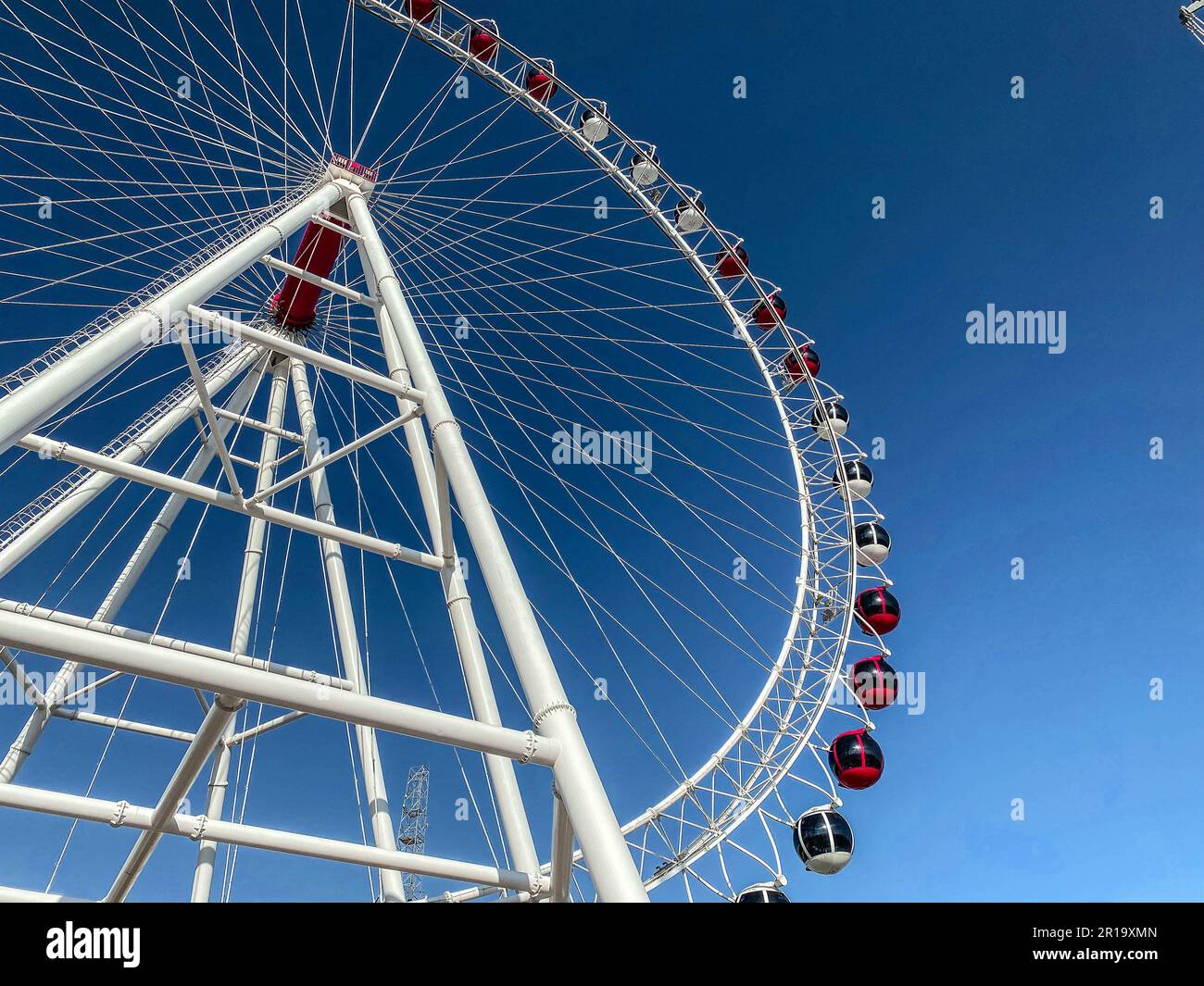 amusement park. ferris wheel made of white metal. a huge wheel with ...