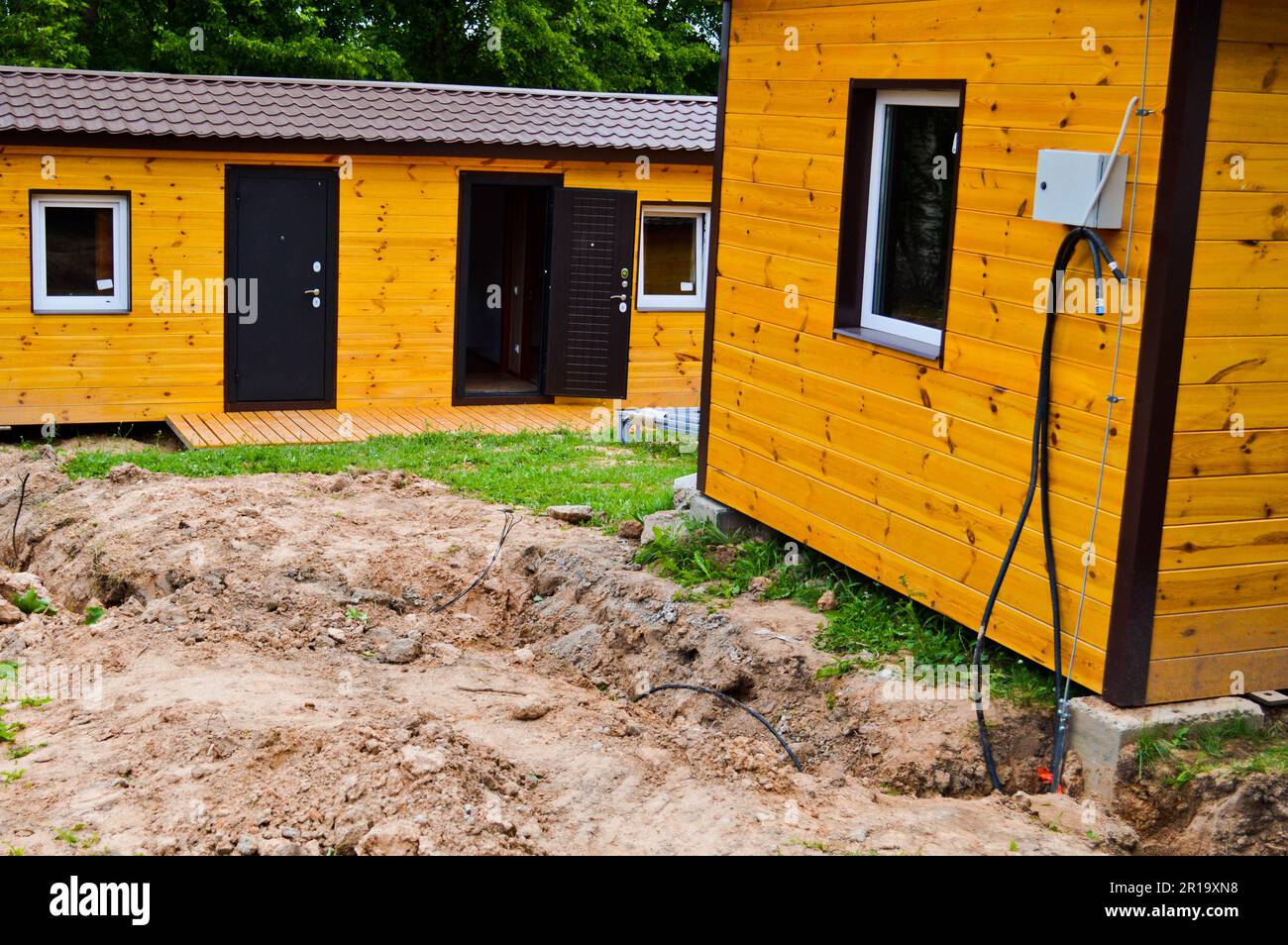 Construction of small yellow wooden frame prefabricated pre-fabricated ...