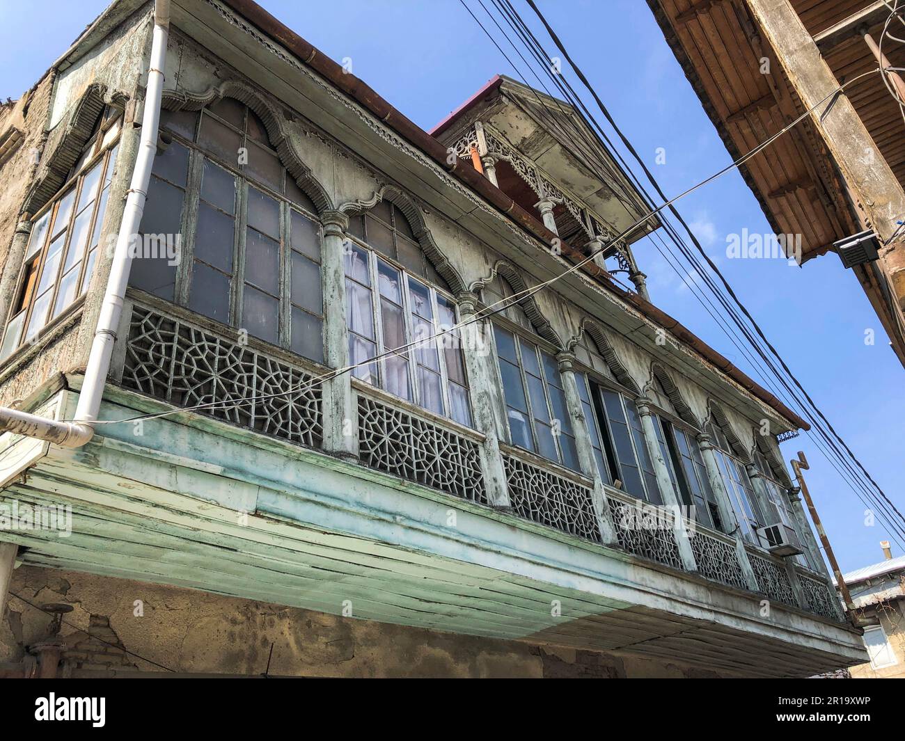 Old carved beautiful antique balcony of a wooden european house ...