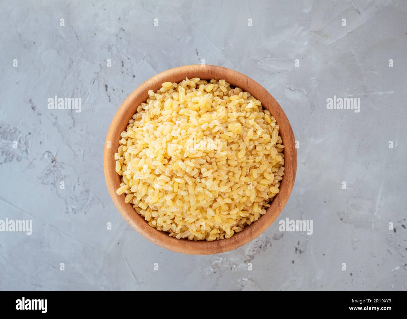 Raw bulgur grain in a bowl. Healthy, dietary, vegan, gluten free ...