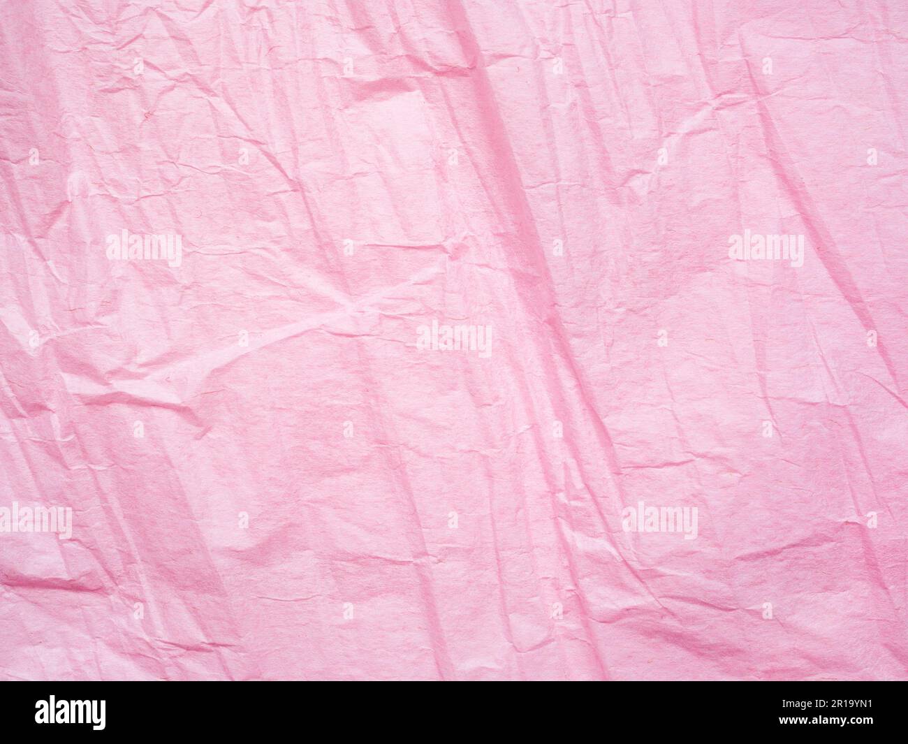 Pink crumpled paper texture background. Macro shot of wrapping paper ...