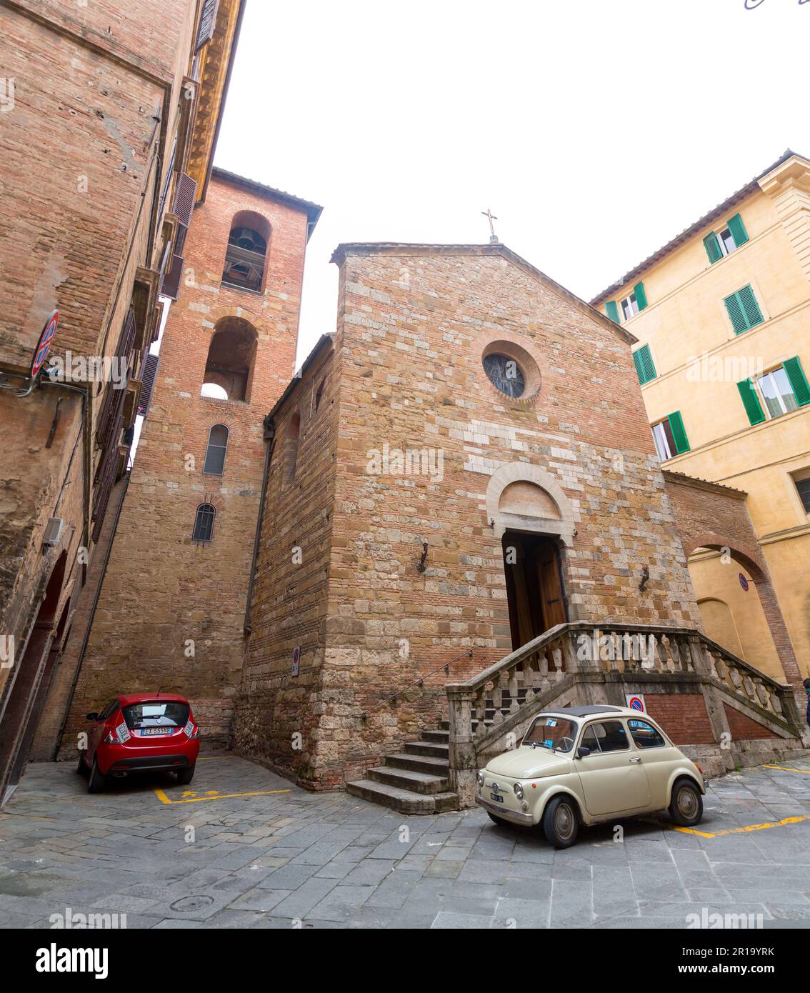 Siena, Italy - APR 7, 2022: Brick and stone walled small church and ...