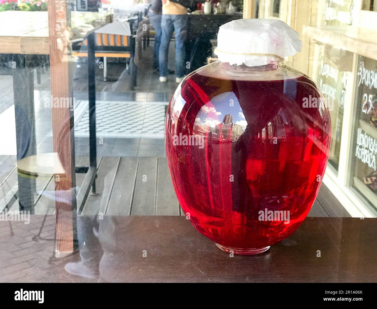 A large red transparent glass round luminous bright jar, the capacity ...