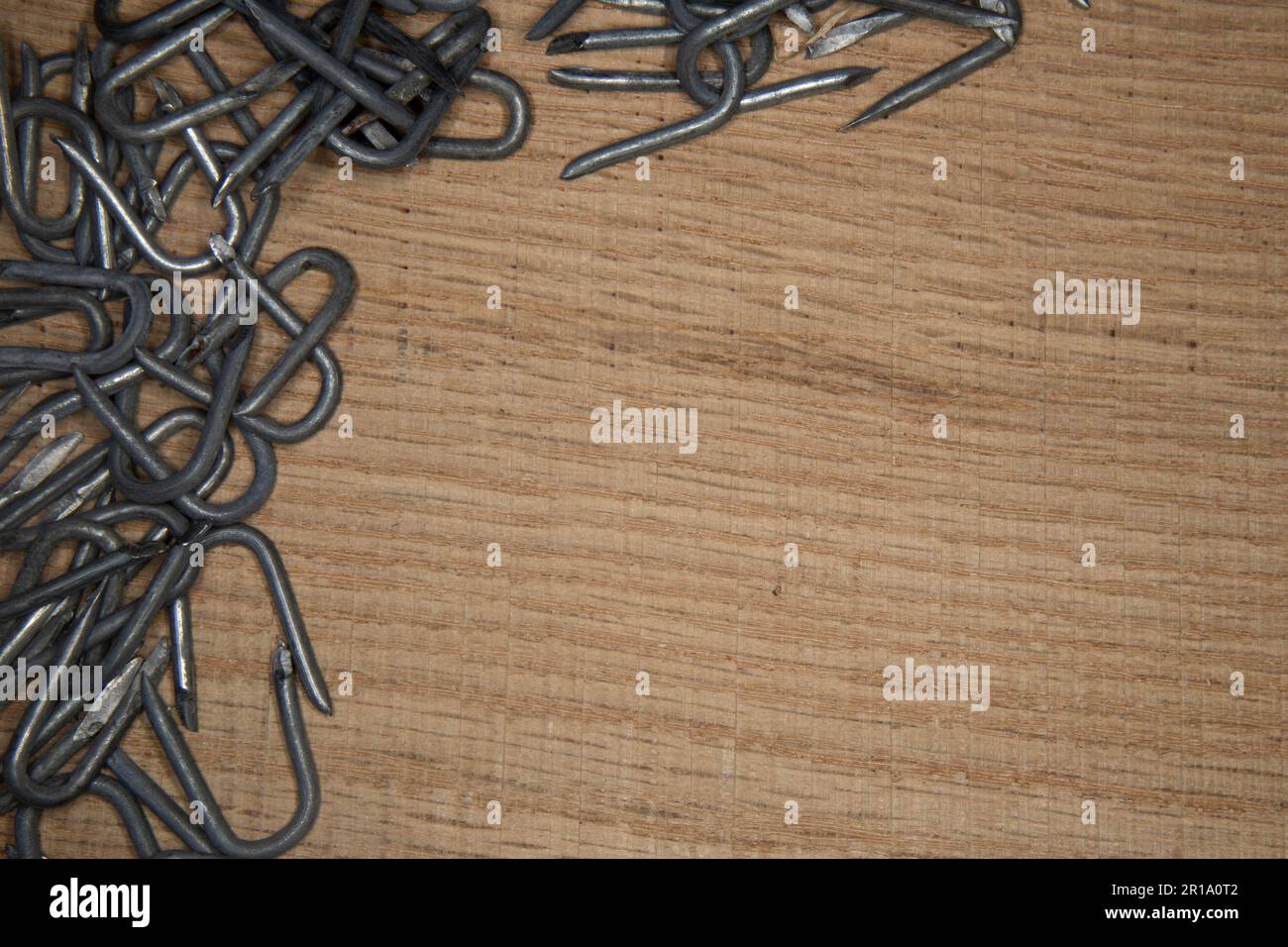 pile of heavy barbed wire staples for construction and carpentry Stock ...
