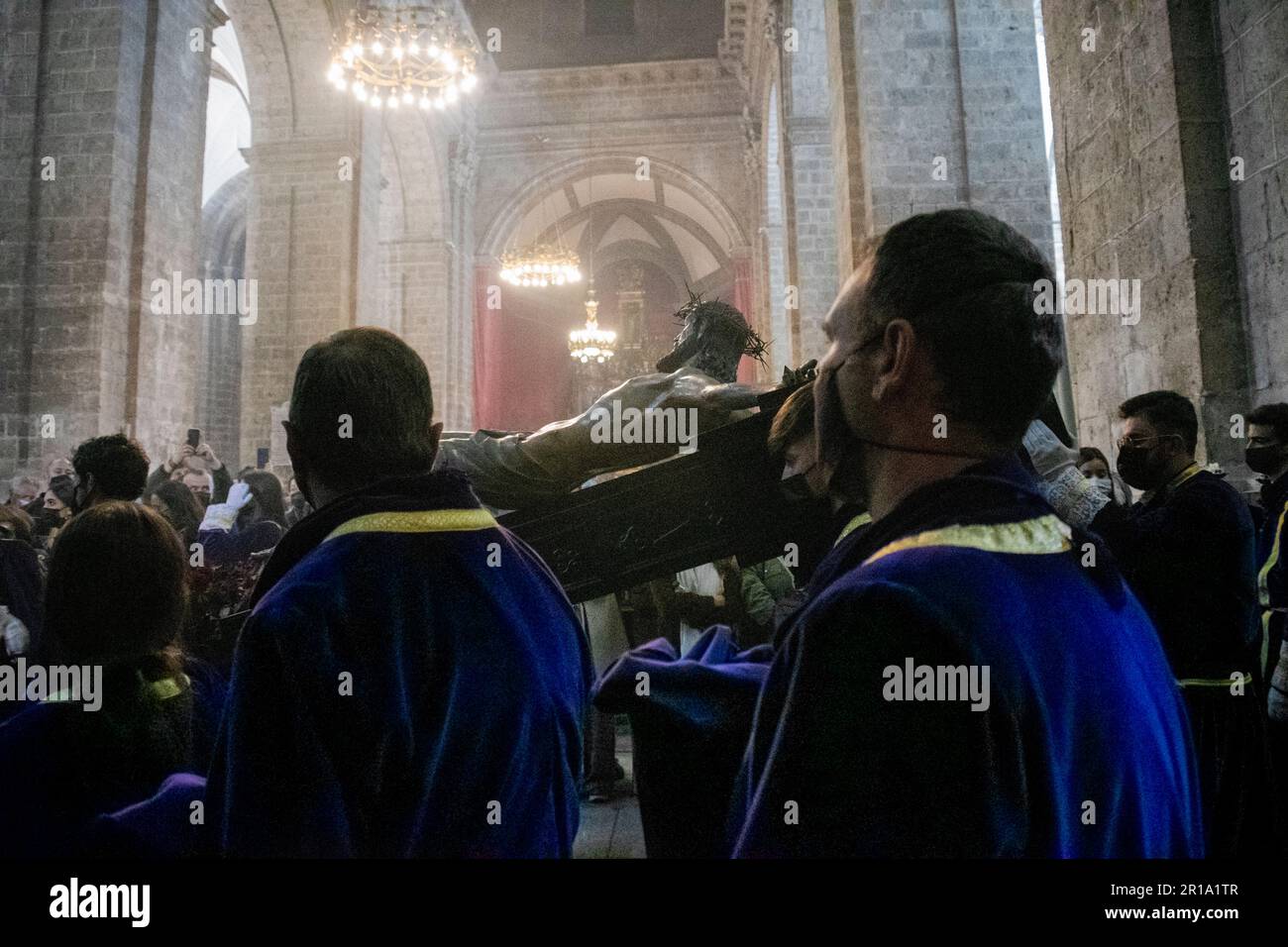Members of the Cofradía Penitencial de Ntro. Padre Jesús Nazareno carry ...