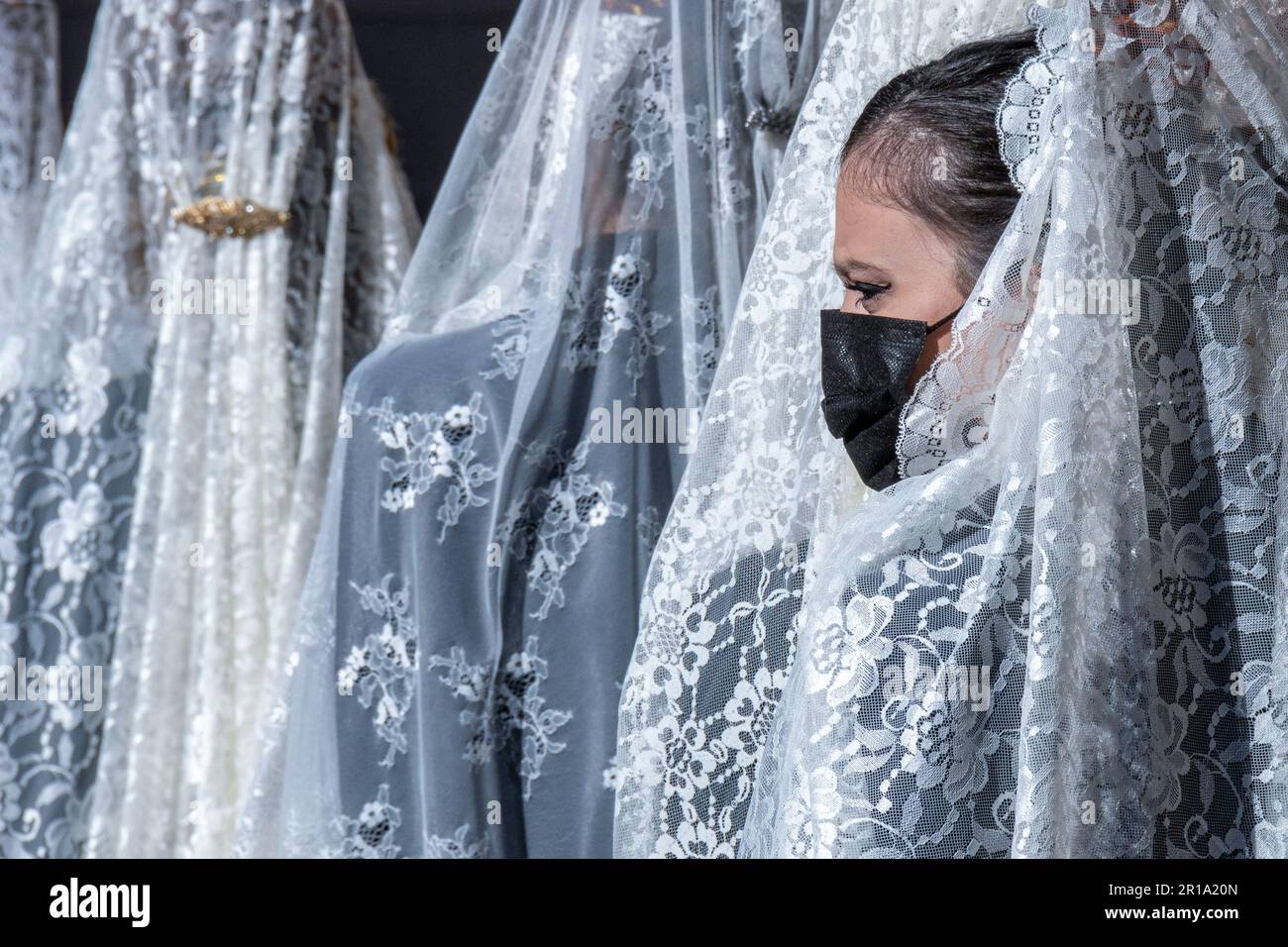 A woman dressed in a traditional Lace Mantilla during the Procesión del ...