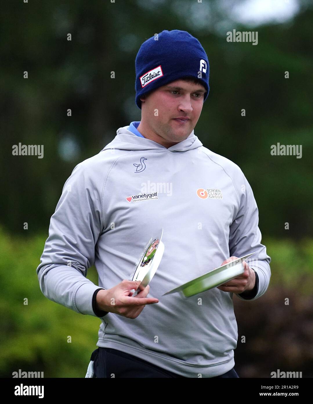 Kipp Popert walks away with his second place trophy during day three of ...