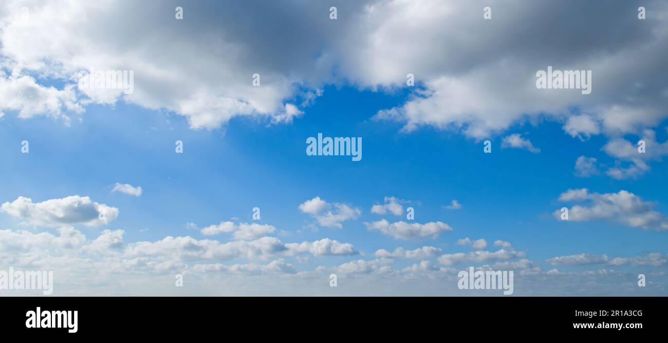 Blue sky with light clouds. Wide photo Stock Photo - Alamy