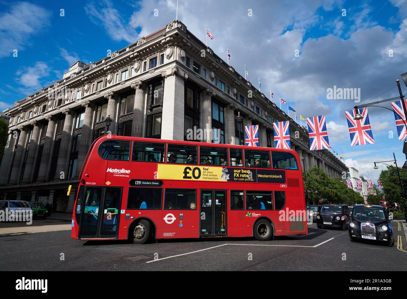 Red double decker bus in London on Oxford Street in the city centre ...