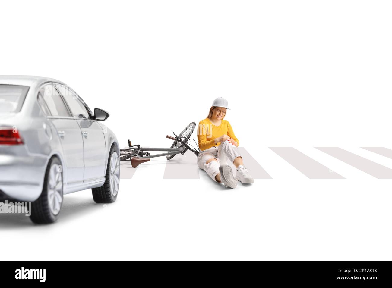 Young female with a bicycle falling on the street in front of a car and ...