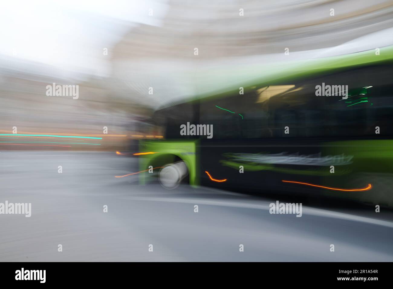 A passenger bus passing by on the streets in the city centre. Shot ...