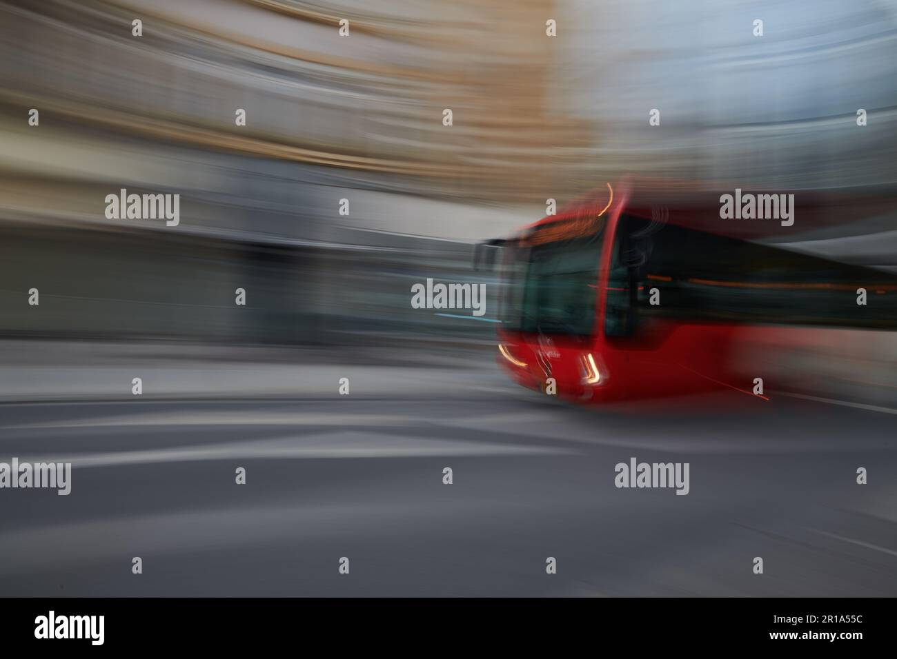 A passenger bus passing by on the streets in the city centre. Shot ...