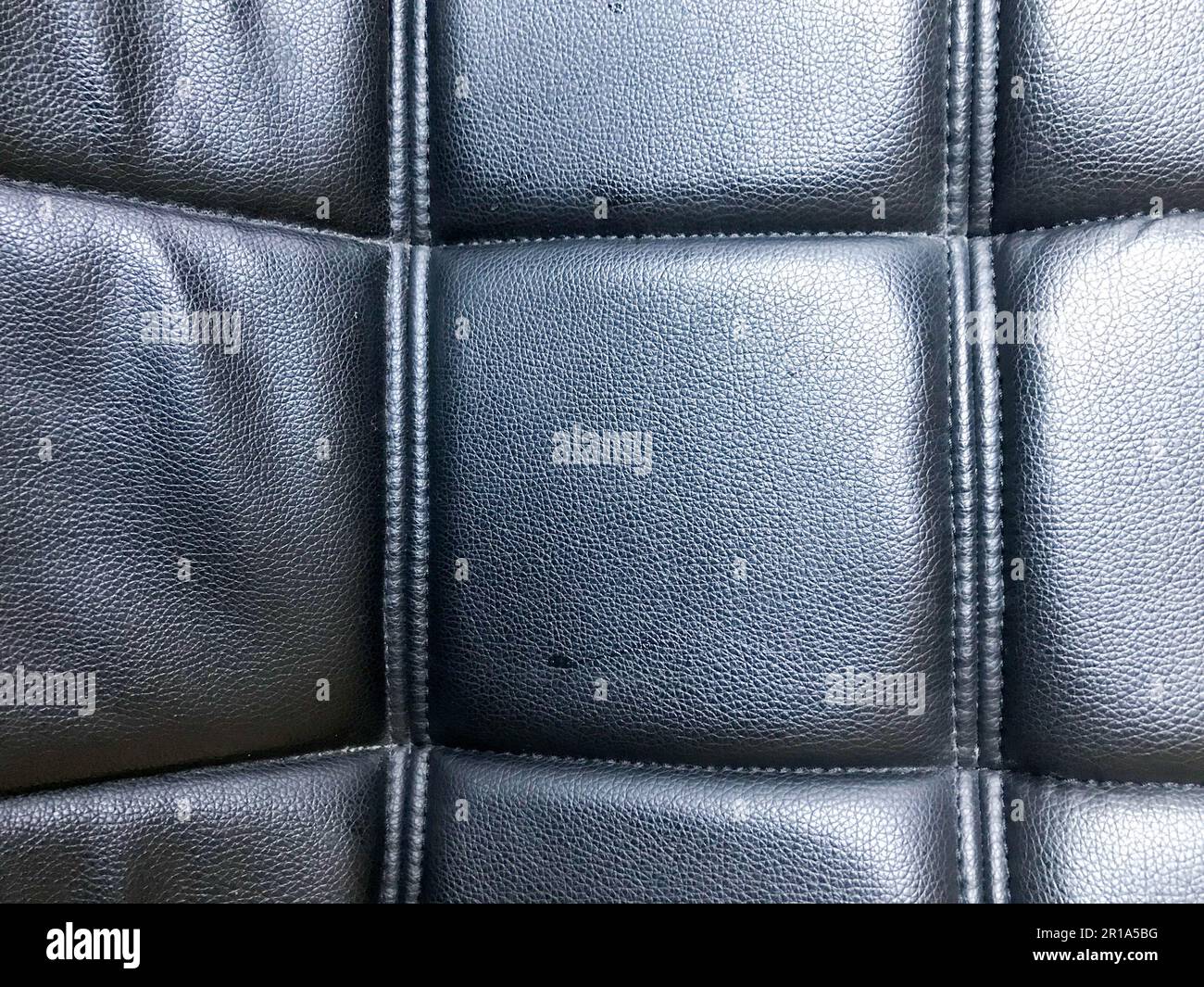 Texture of a relief surface made of black leather, artificial and ...