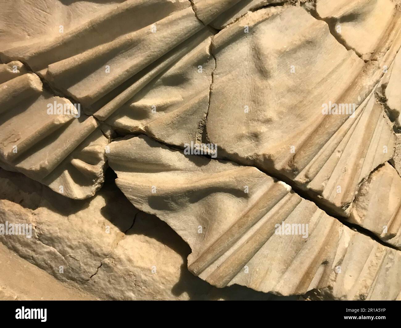 texture of a wall of sandy rock from a yellow friable old rotten stone ...
