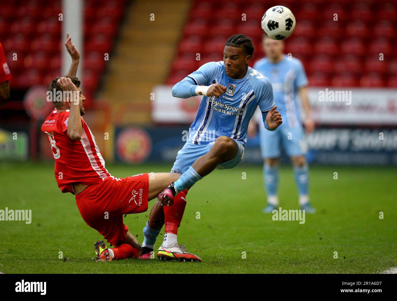 Coventry City’s Tristen Batanwi is tackled by Stourbridge’s Reece King ...