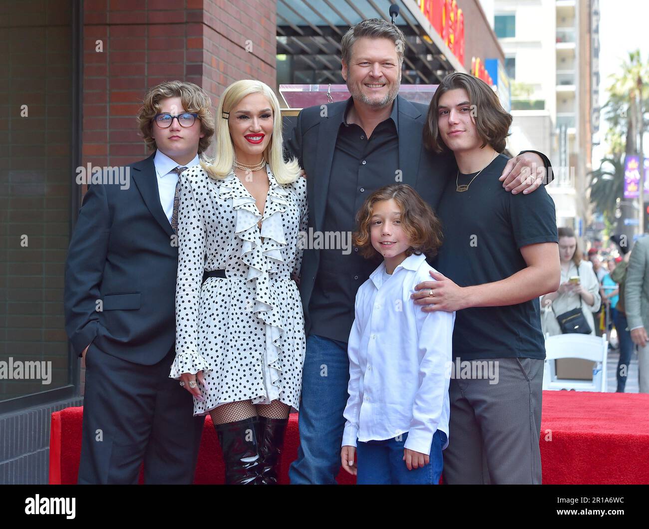Gwen Stefani, second from left, and Blake Shelton, center, pose with ...