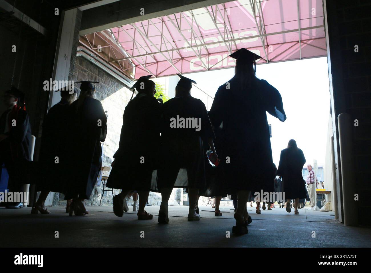 Virginia Tech class of 2023 graduates head into Lane Stadium for a ...