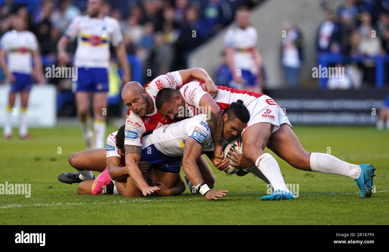 Warrington Wolves Peter Mata'utia is tackled by Hull KR's Elliot ...