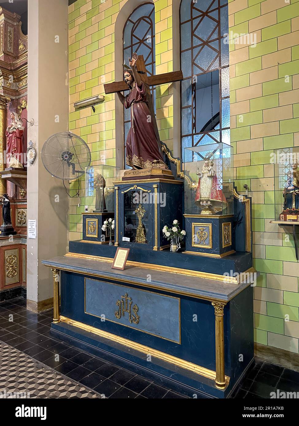 A statue of Christ carrying His cross on an altar in Our Lady of Loreto ...