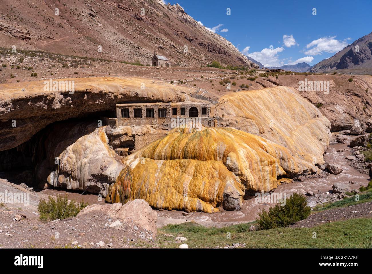 Colorful travertine deposits of the mineral spring at Puente del Inca ...
