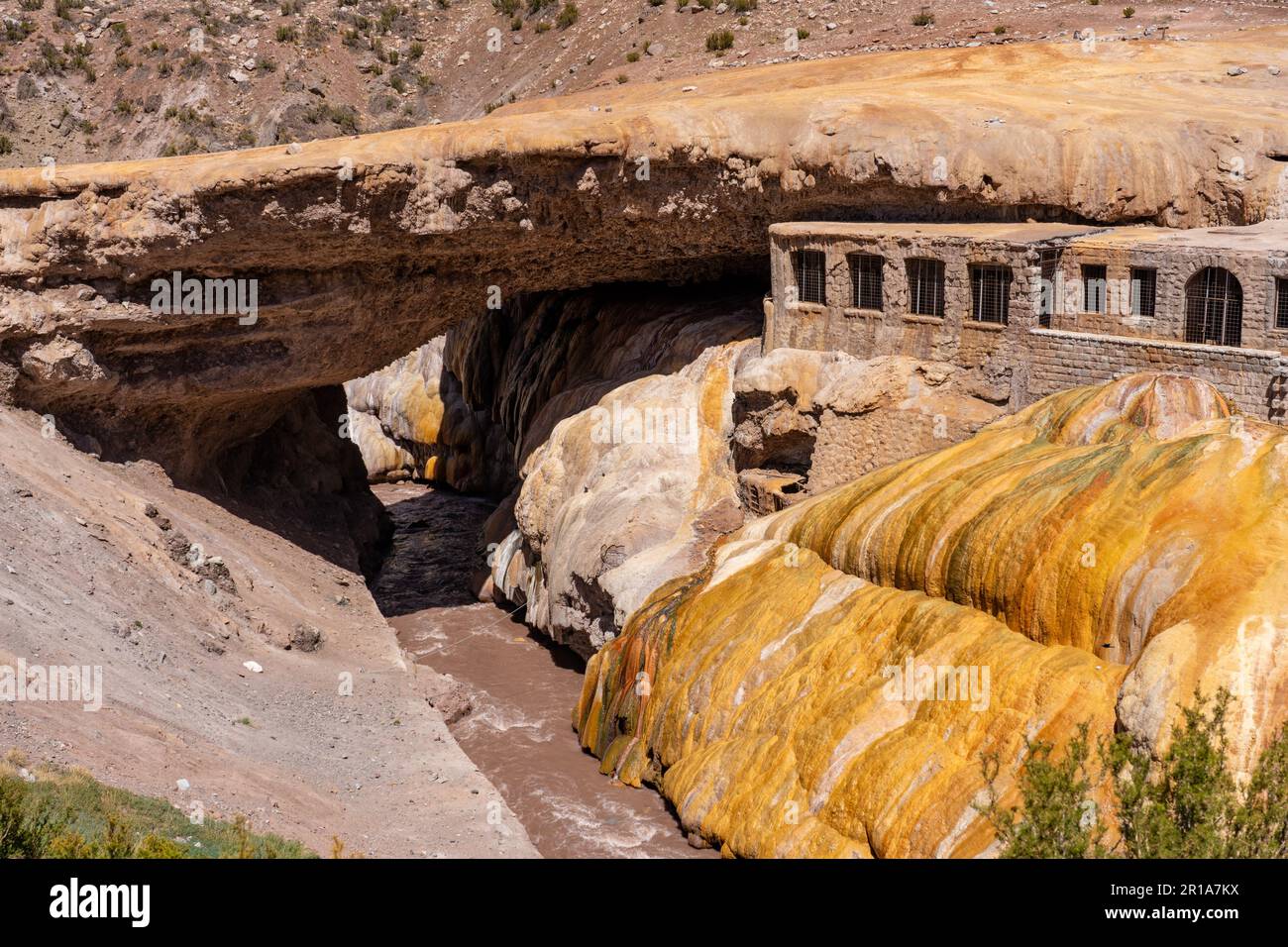 Colorful travertine deposits of the mineral spring at Puente del Inca ...