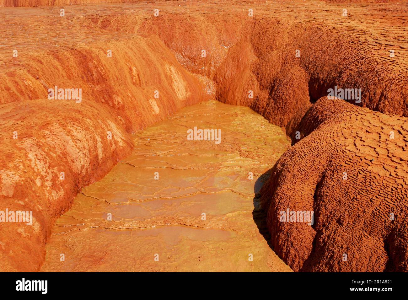 Colorful travertine deposits around the Crystal Geyser, a cold-water ...