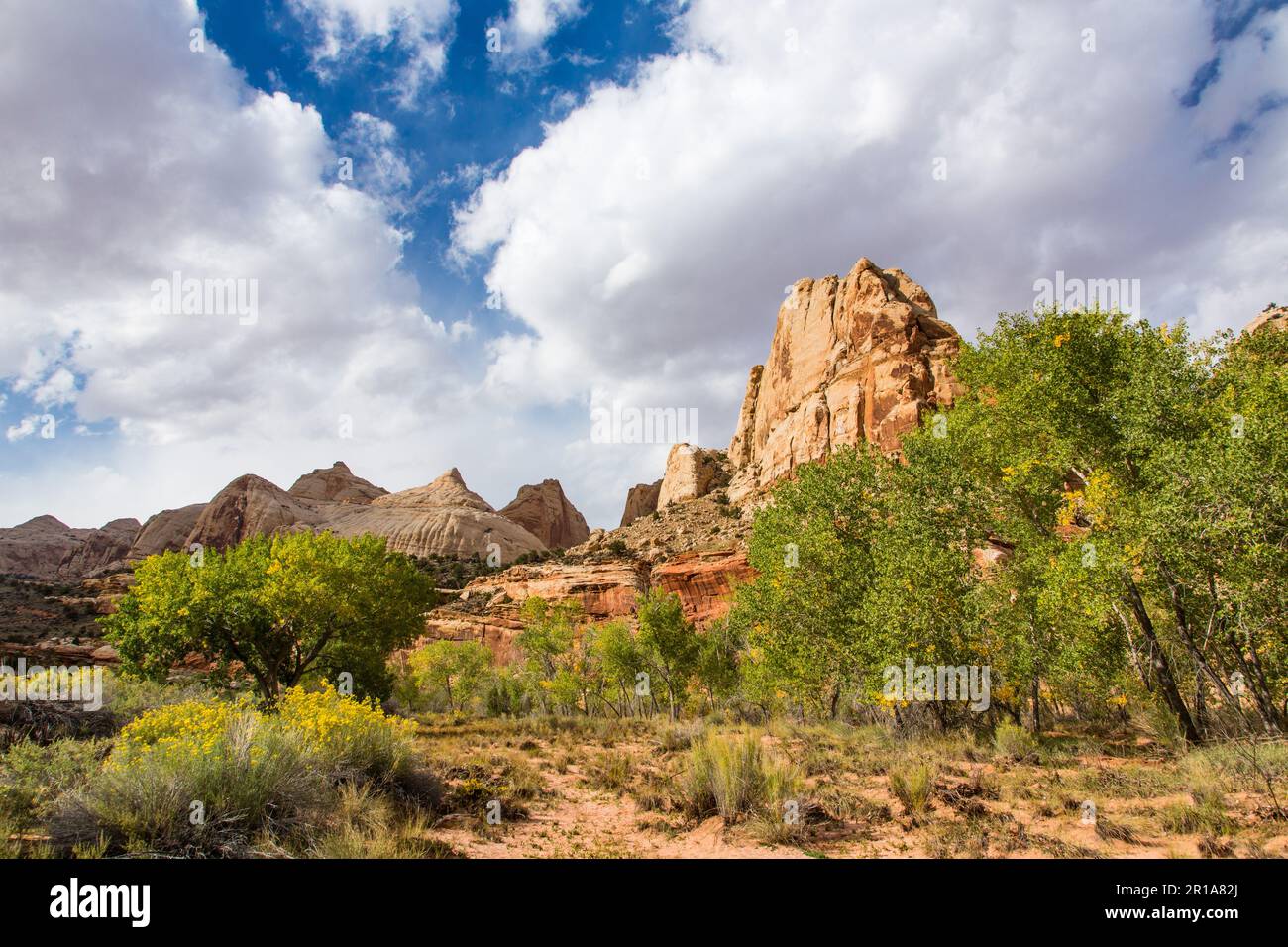 The pointed Navajo sandstone pyramid known as the Navajo Dome, left ...